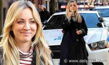 Kaley Cuoco swigs vodka while leaning on a police car on the set of The ...