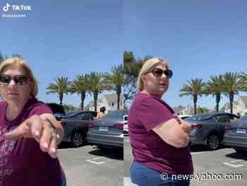 A new 'parking lot Karen' is going viral on TikTok for physically blocking someone's car from an ...