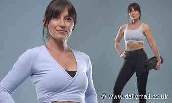 Davina McCall displays her washboard abs in a grey crop top as she ...