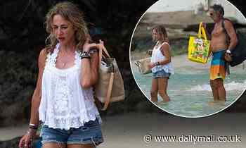 Gary Lineker's ex-wife Michelle Cockayne enjoys a stroll with mystery ...