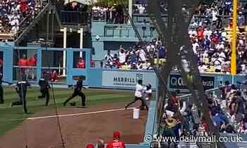 Moment Los Angeles Dodgers ball girl tackles pitch invader forcing him ...
