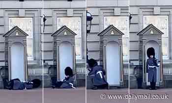 Queen's Guard soldier appears to overbalance and topples backwards in ...